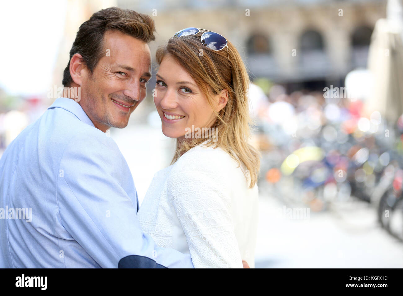 Fancy loving couple in town embracing each other Stock Photo - Alamy