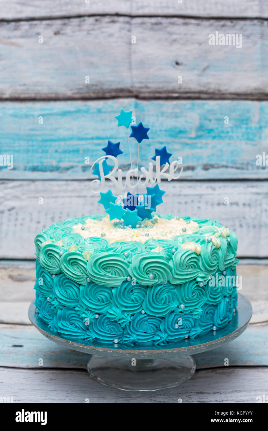 Cyan and blue one layer birthday cake with edible marzipan stars Stock ...