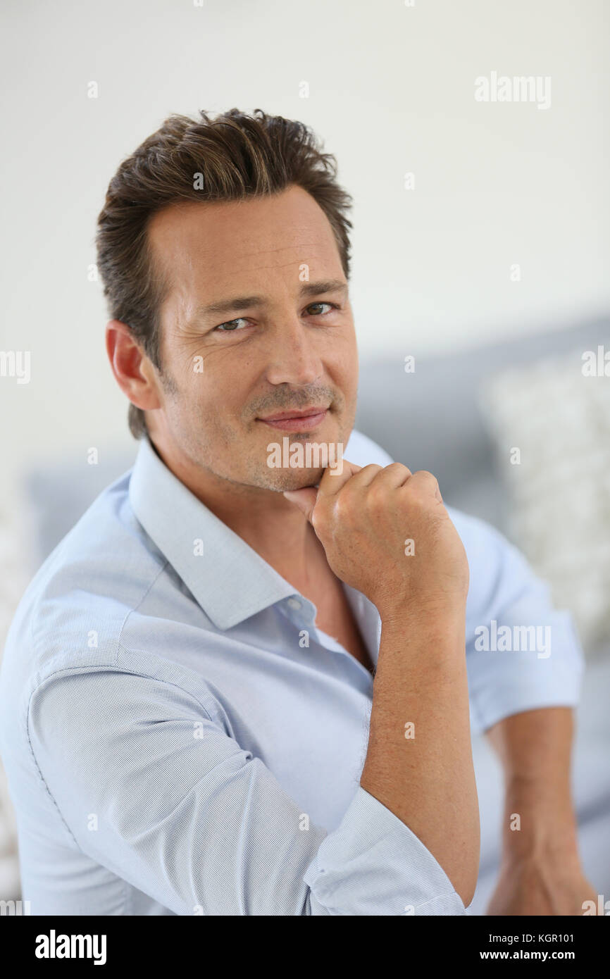 Smiling handsome man with blue shirt Stock Photo - Alamy Smiling handsome man with blue shirt Stock Photo - Alamy