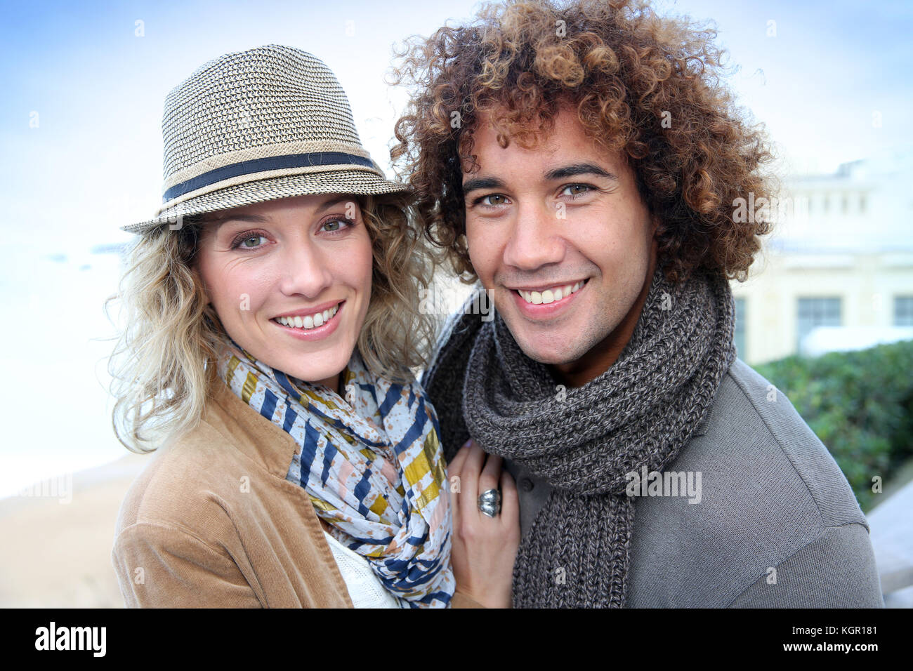 Trendy cheerful couple out in town Stock Photo - Alamy