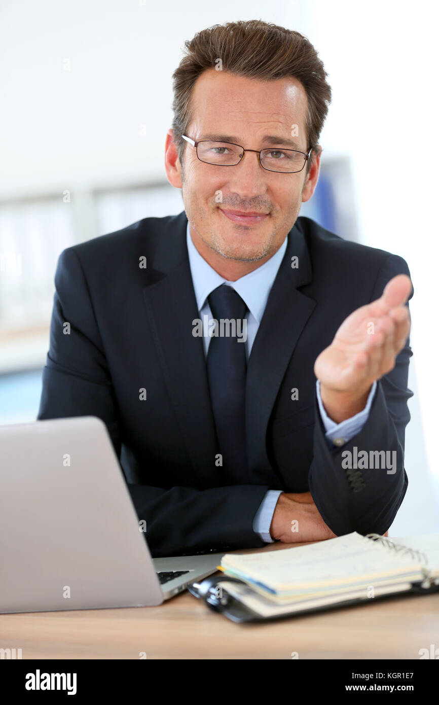 Businessman in office meeting business partner Stock Photo - Alamy