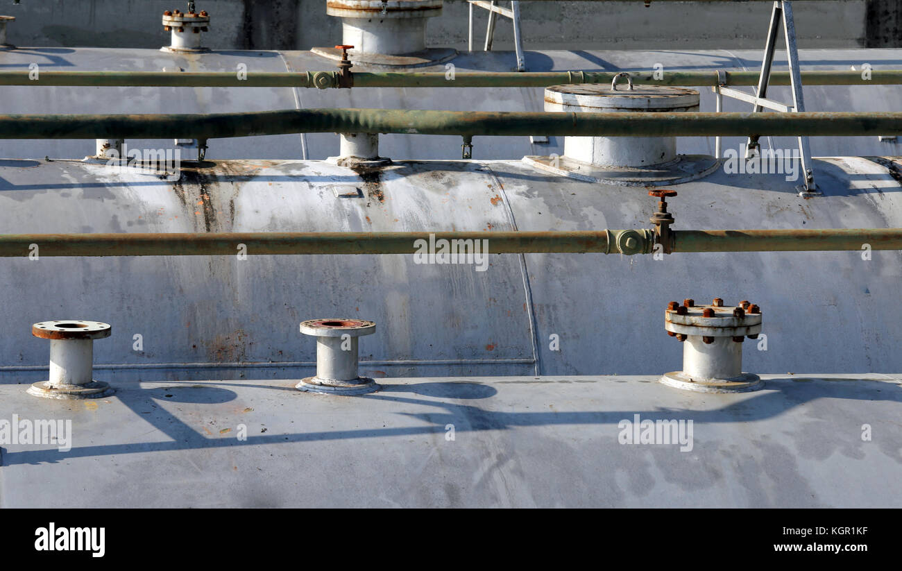 cover with bolts over many big tanks to contain methane gas in an ...