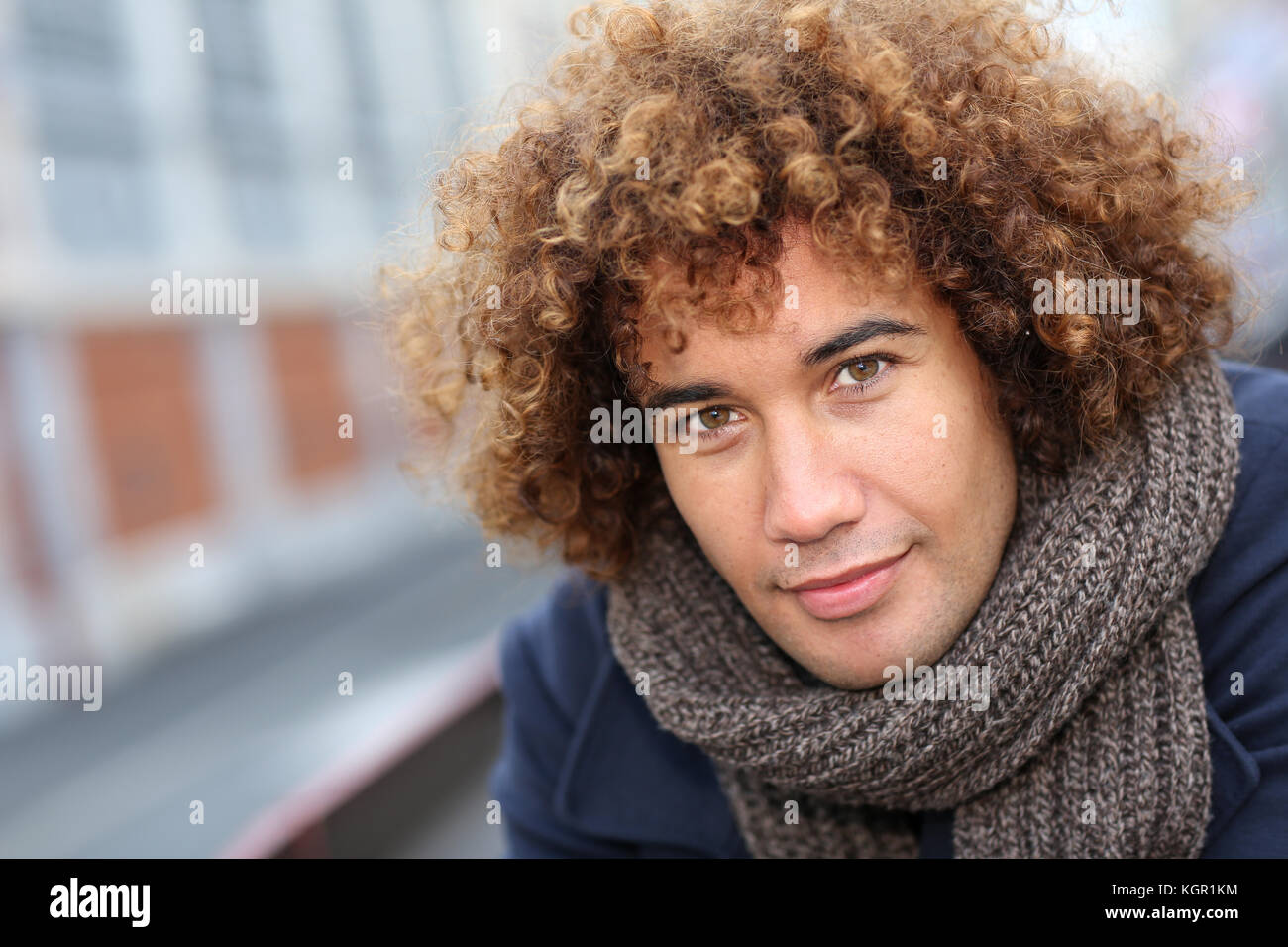 Handsome mixed-raced guy in city street Stock Photo - Alamy