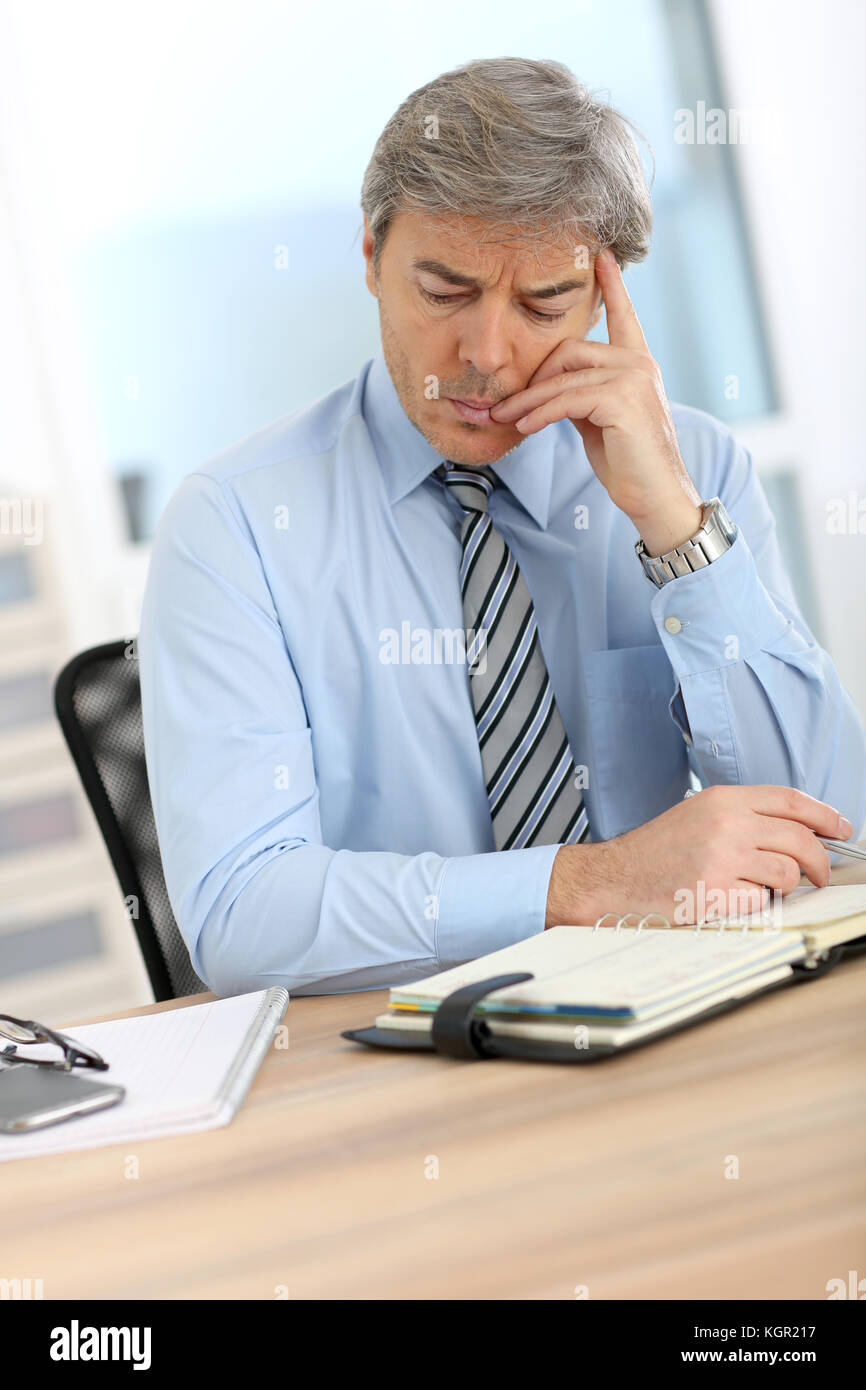 Businessman with worried expression on his face Stock Photo - Alamy