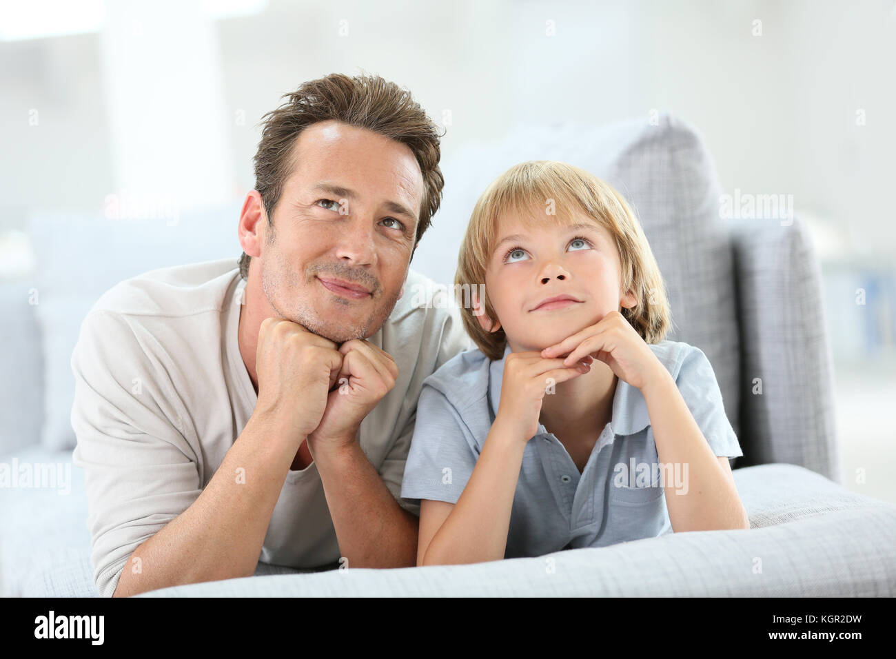 Portrait of daddy and son having a dream Stock Photo - Alamy
