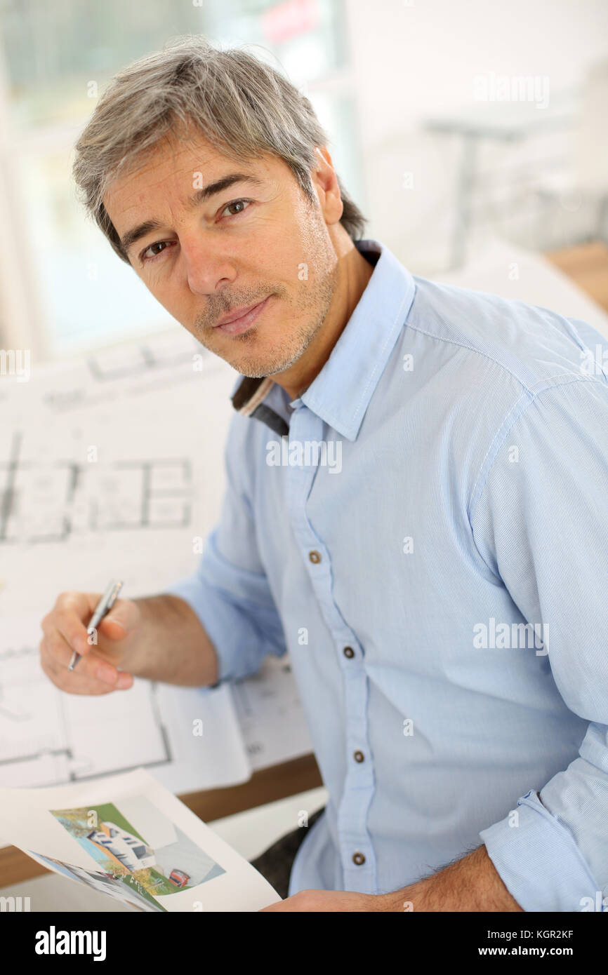 Architect designing house for client Stock Photo - Alamy