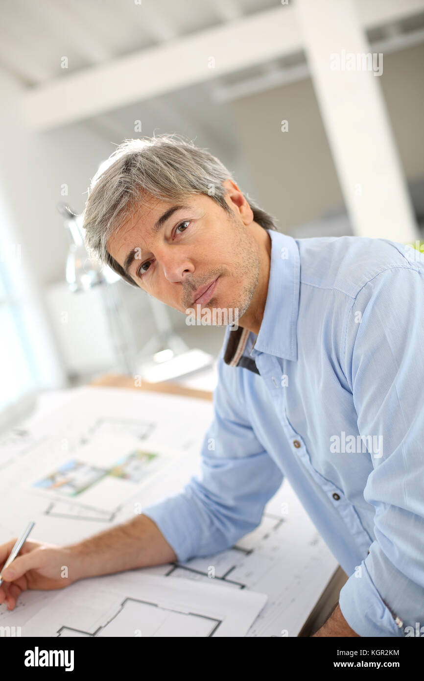 Portrait of smiling architect working in office Stock Photo - Alamy