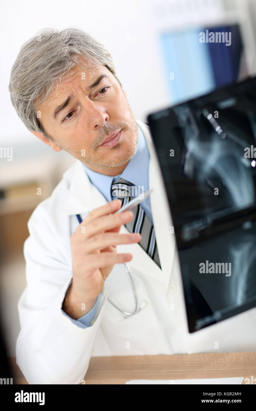 Doctor checking on X-ray results Stock Photo - Alamy