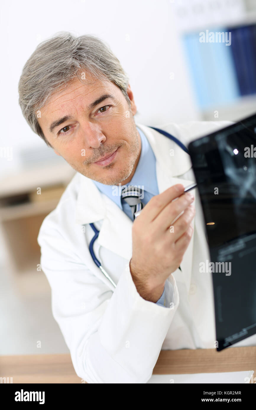 Doctor checking on X-ray results Stock Photo - Alamy