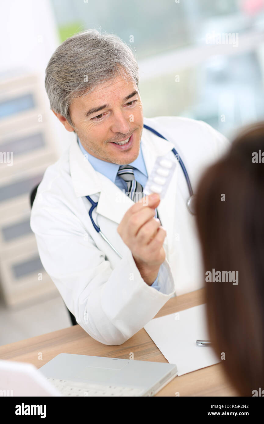 Doctor with patient in consultation room Stock Photo - Alamy
