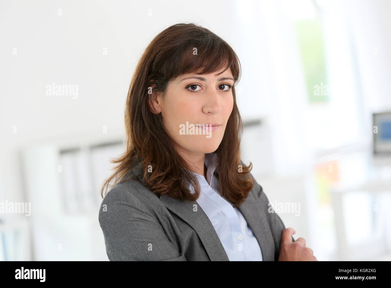 Portrait smiling saleswoman standing arms hi-res stock photography and ...