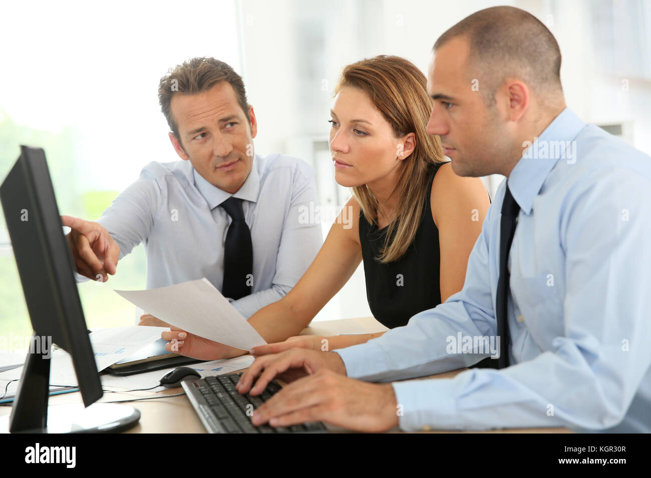 Business people working on desktop computer Stock Photo - Alamy