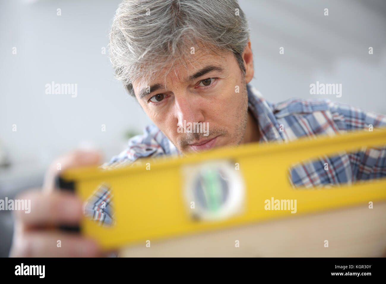 Closeup of craftsman using level Stock Photo - Alamy