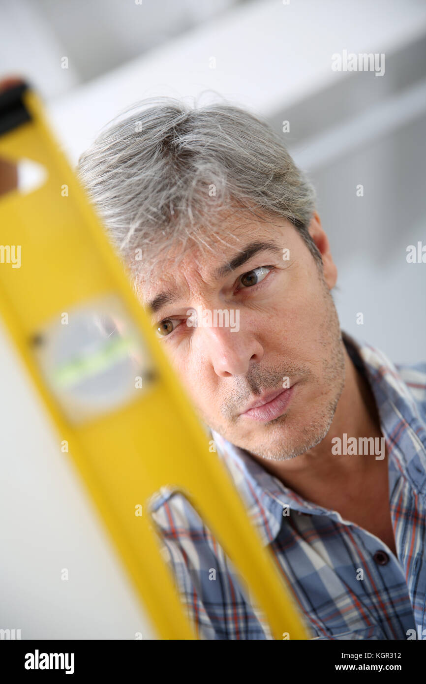 Closeup of craftsman using level Stock Photo - Alamy