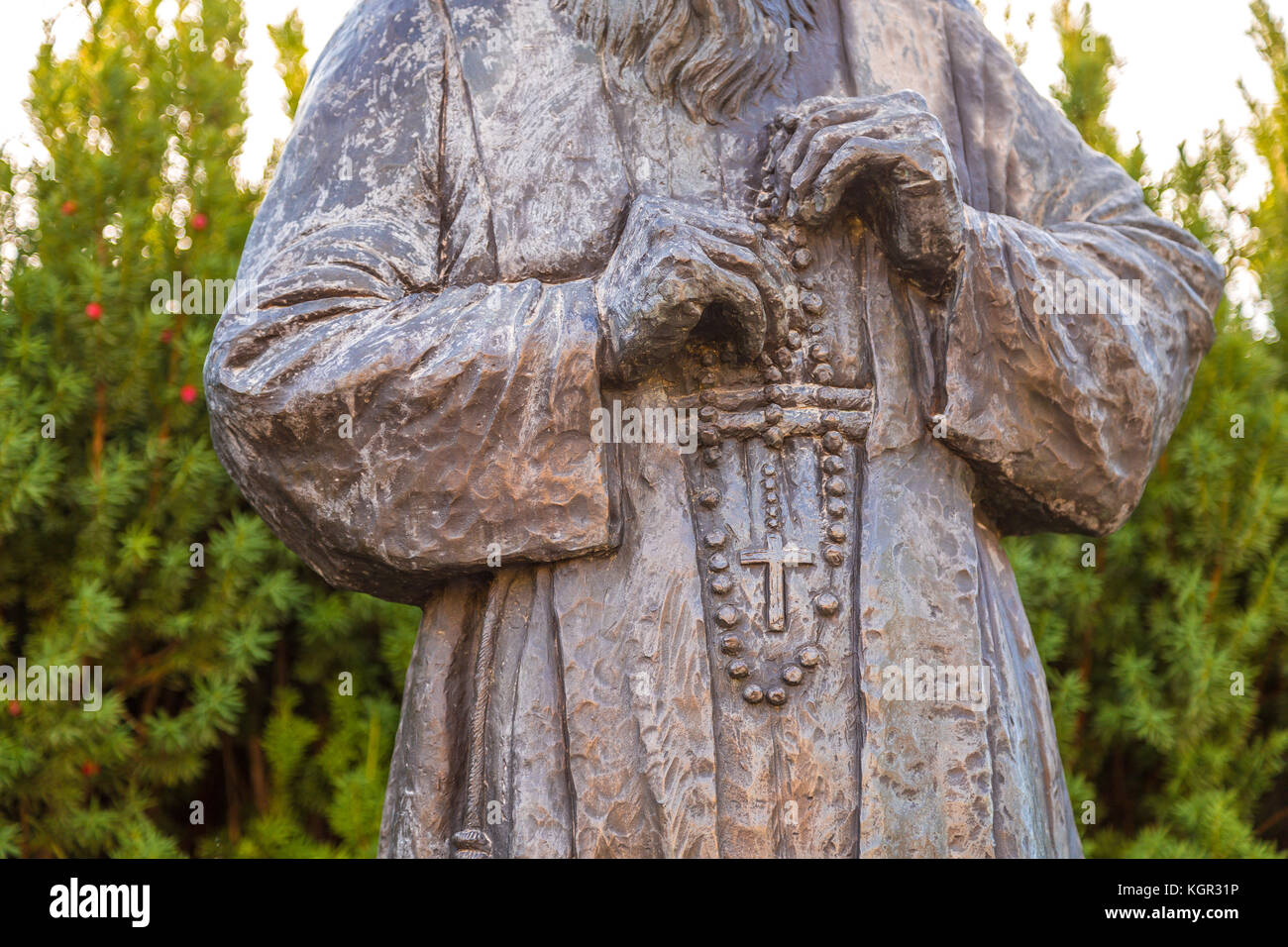 monk statue holding a rosary Stock Photo - Alamy