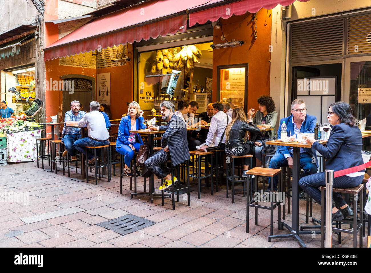 Late afternoon diners at Osteria 051 street food bar on Via Pescerie ...