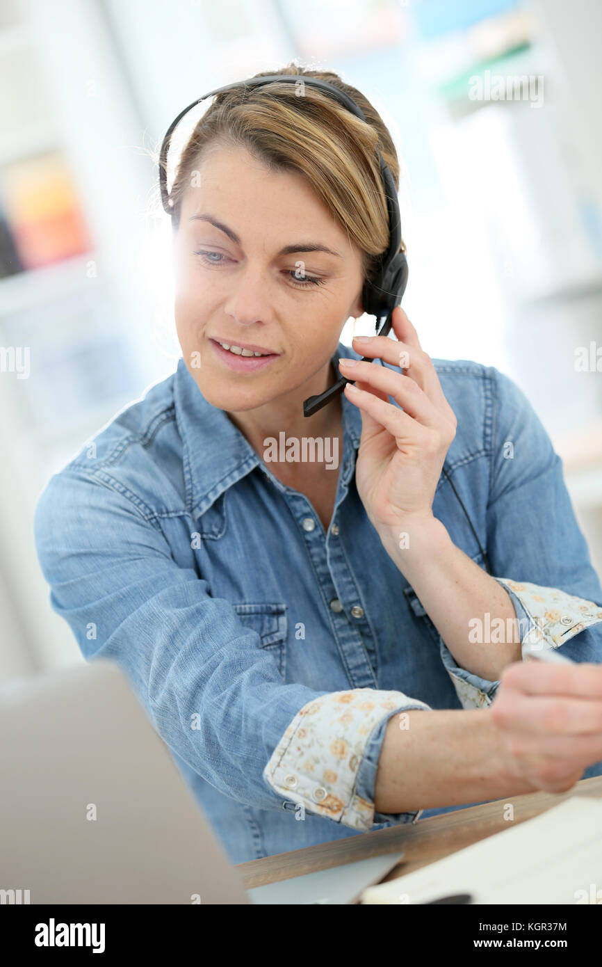 Active woman teleworking from home Stock Photo - Alamy