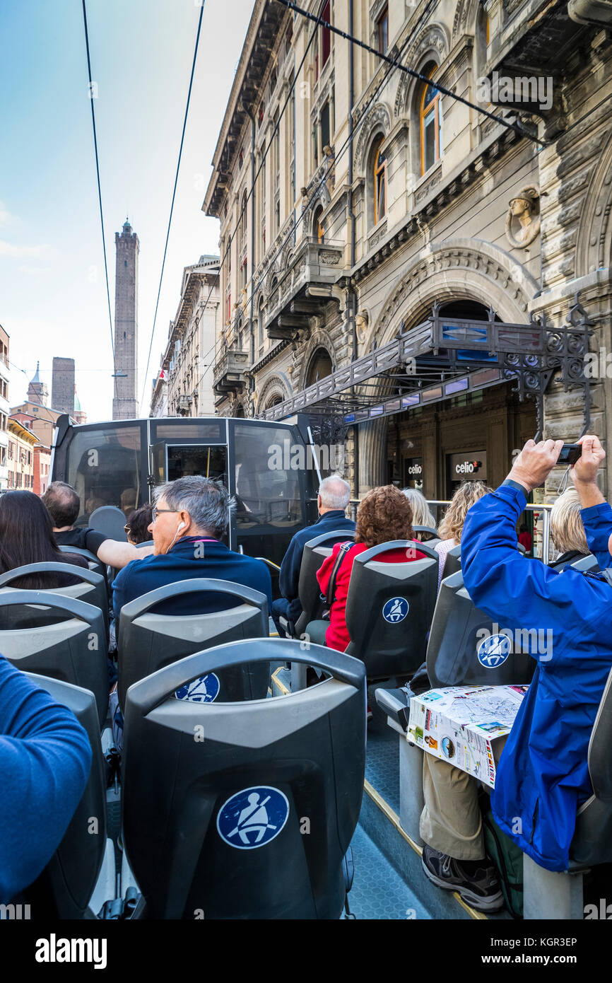 Tourists and visitors take the red bus tour through the city, Bologna ...