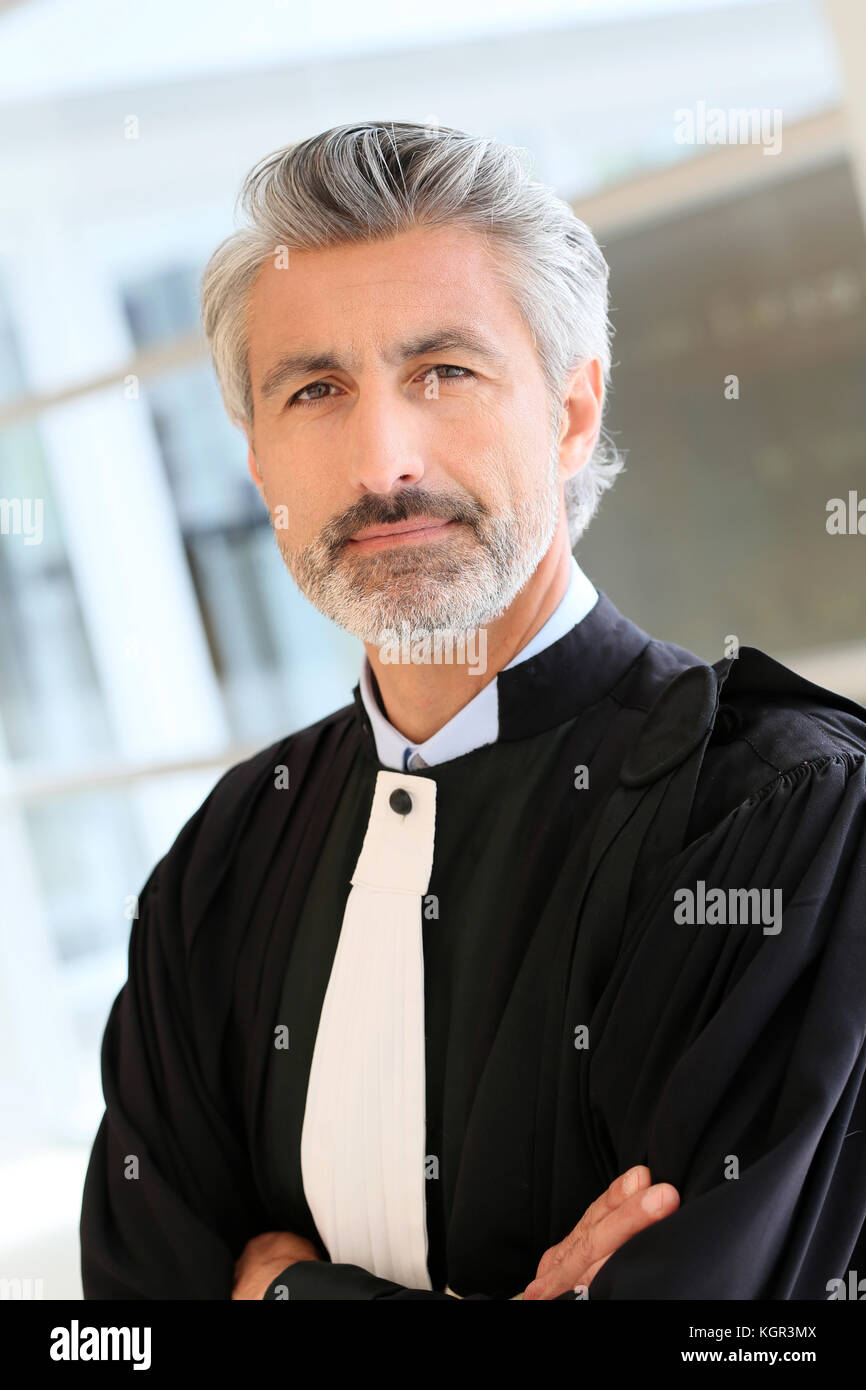 Portrait of lawyer standing in courthouse corrridor Stock Photo - Alamy