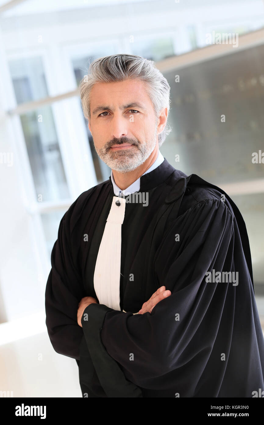 Portrait of lawyer standing in courthouse corrridor Stock Photo - Alamy