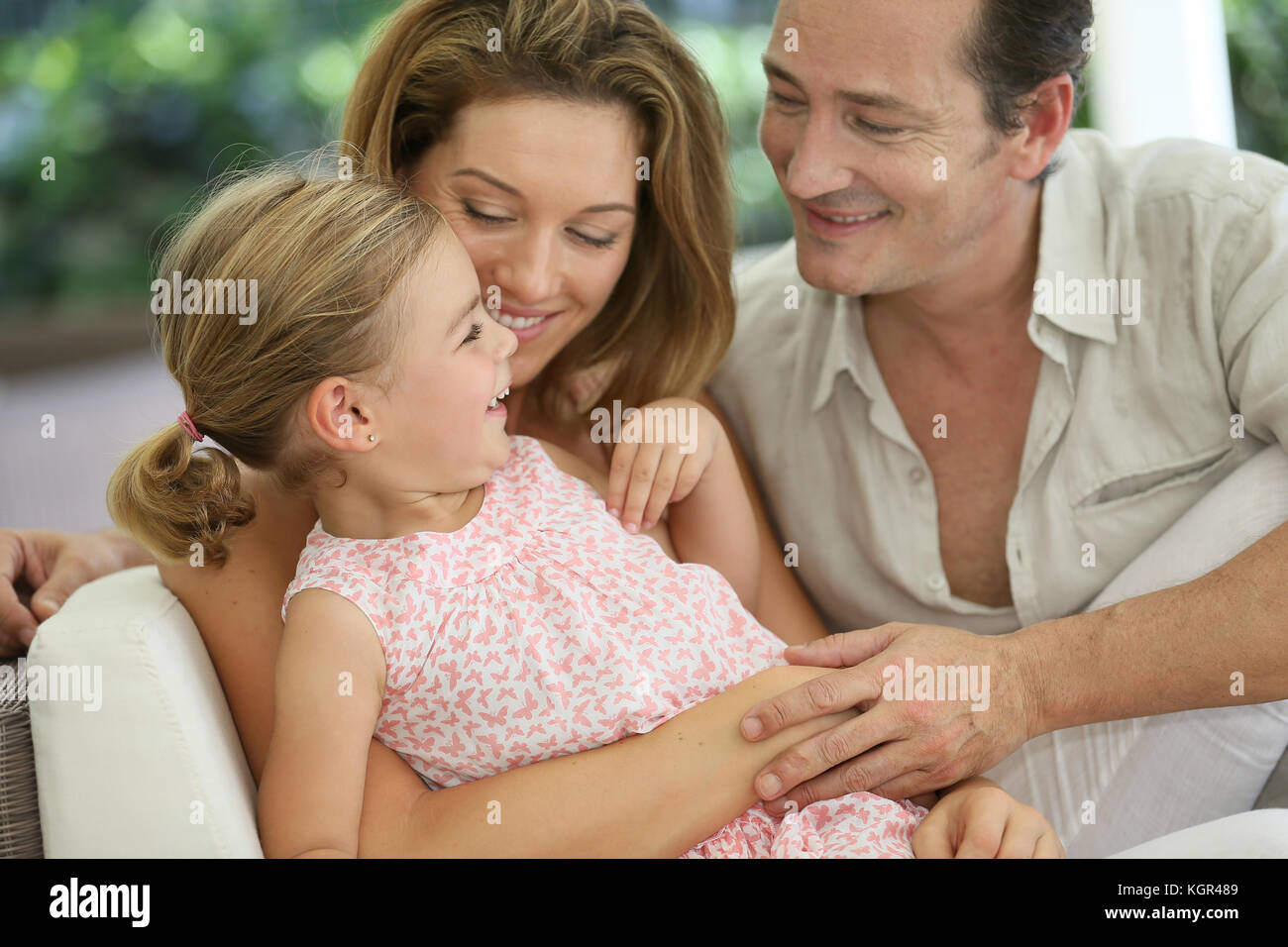 Portrait of happy family laughing together Stock Photo - Alamy