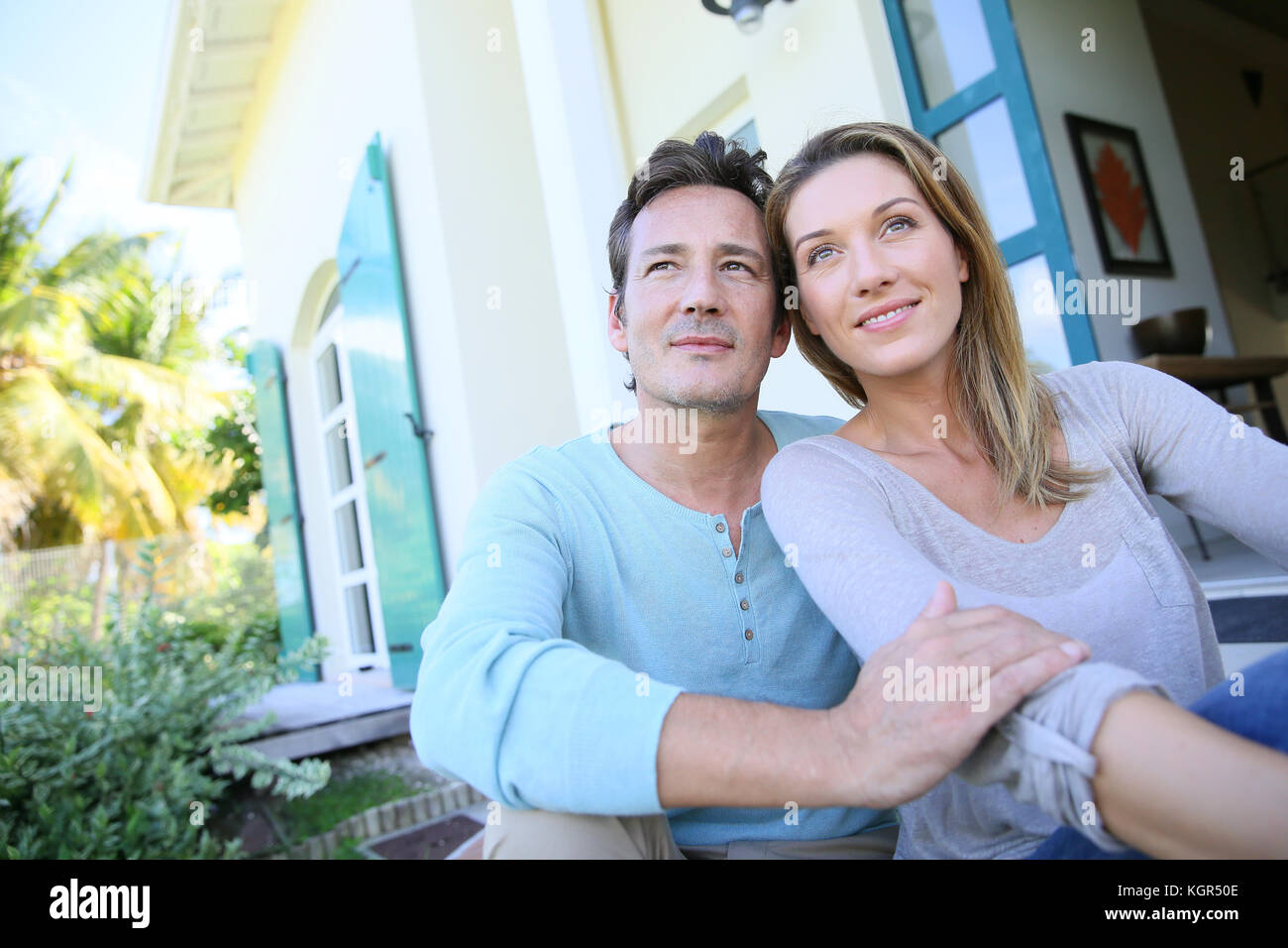 Old man sitting outside house hi-res stock photography and images - Alamy