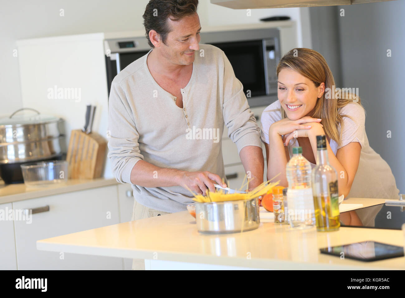 Preparing supper hi-res stock photography and images - Alamy