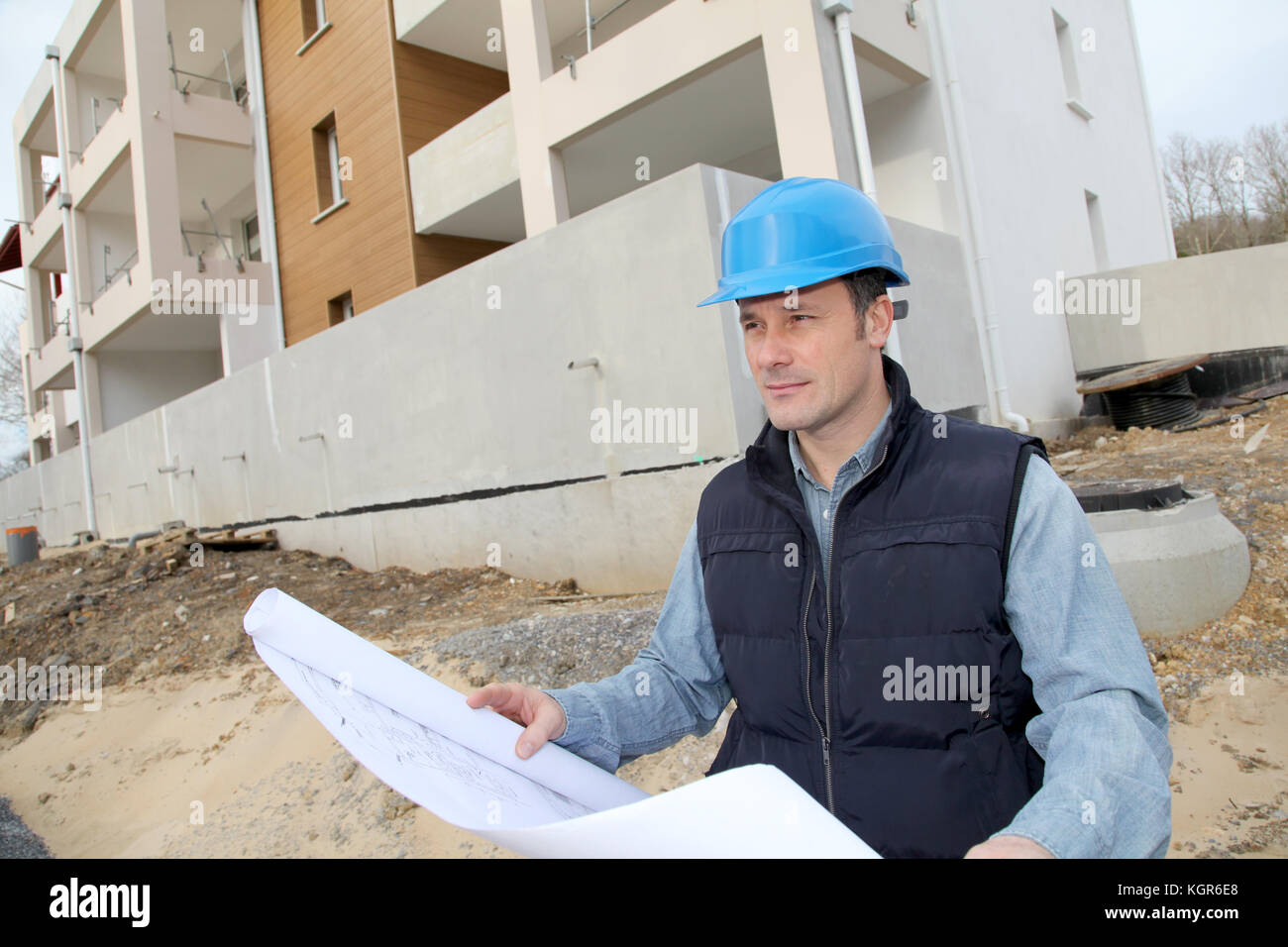 Construction manager on building site Stock Photo - Alamy