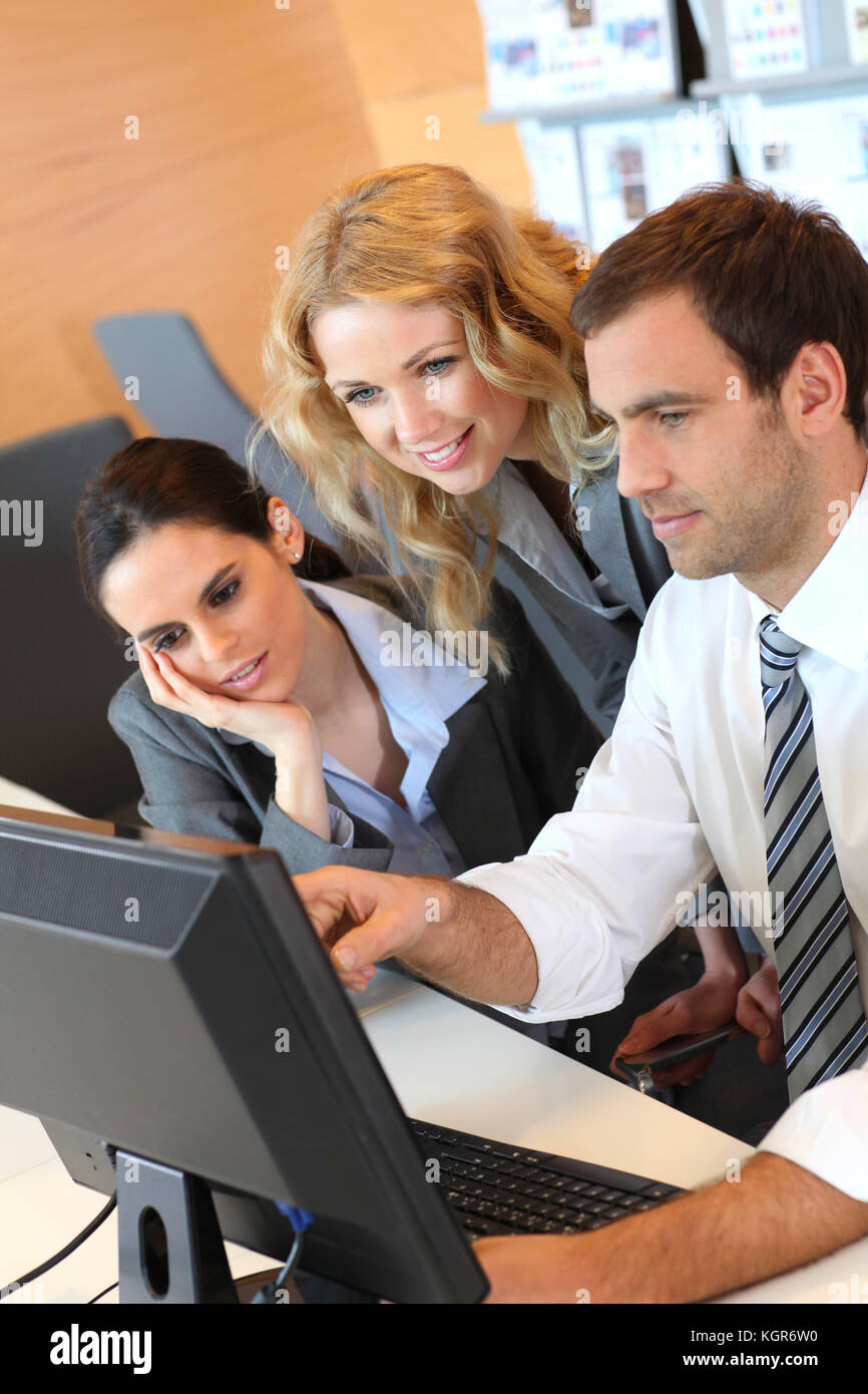 Business meeting in front of desktop computer Stock Photo - Alamy