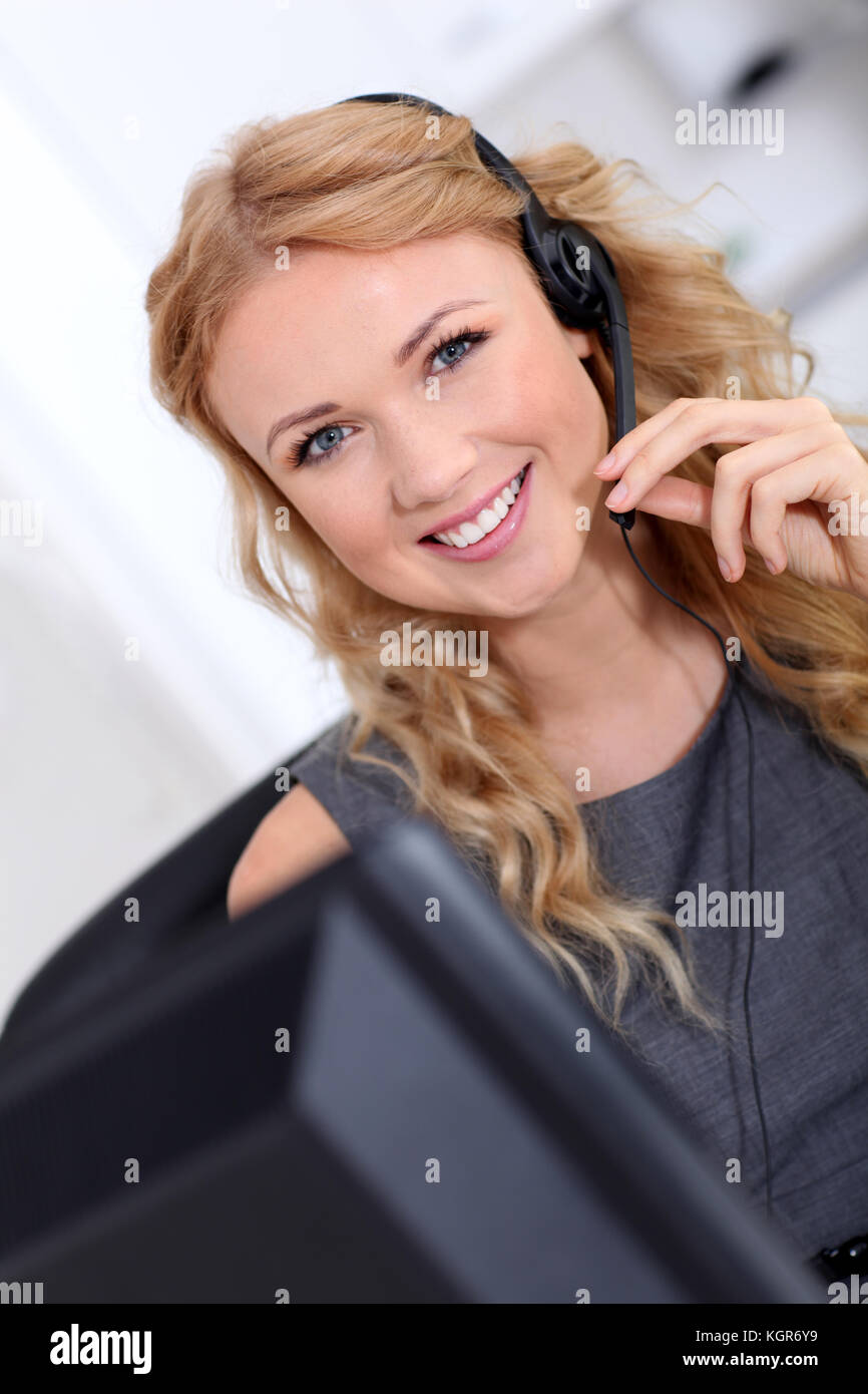 Beautiful customer-service woman with headset on Stock Photo - Alamy