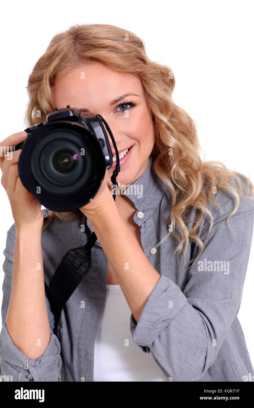 Woman using photo camera in studio Stock Photo - Alamy