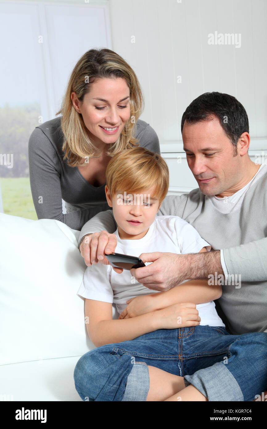 Family playing video game on smartphone Stock Photo - Alamy