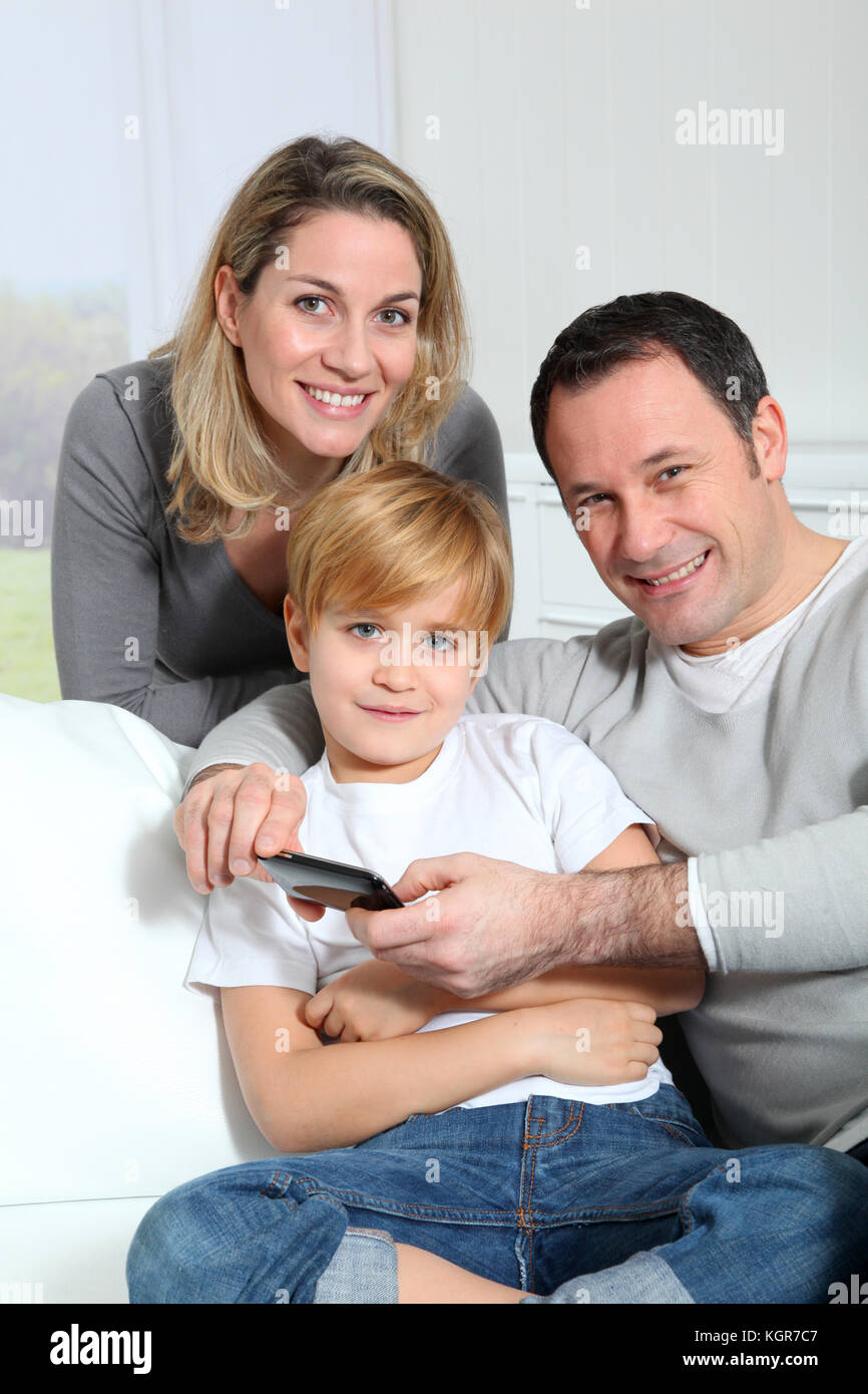 Family playing video game on smartphone Stock Photo - Alamy