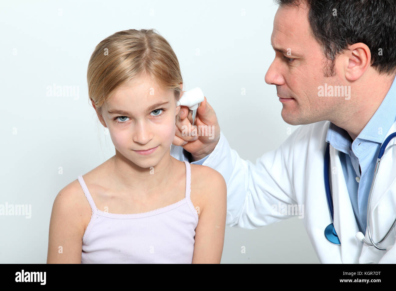 Doctor doing child medical check-up Stock Photo - Alamy