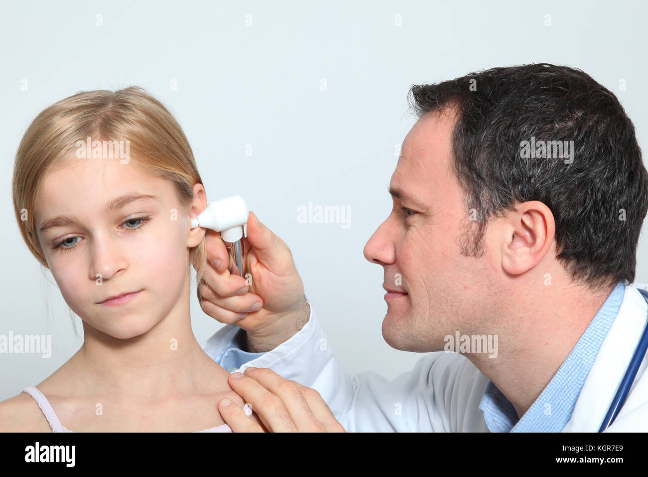 Doctor doing child medical check-up Stock Photo - Alamy