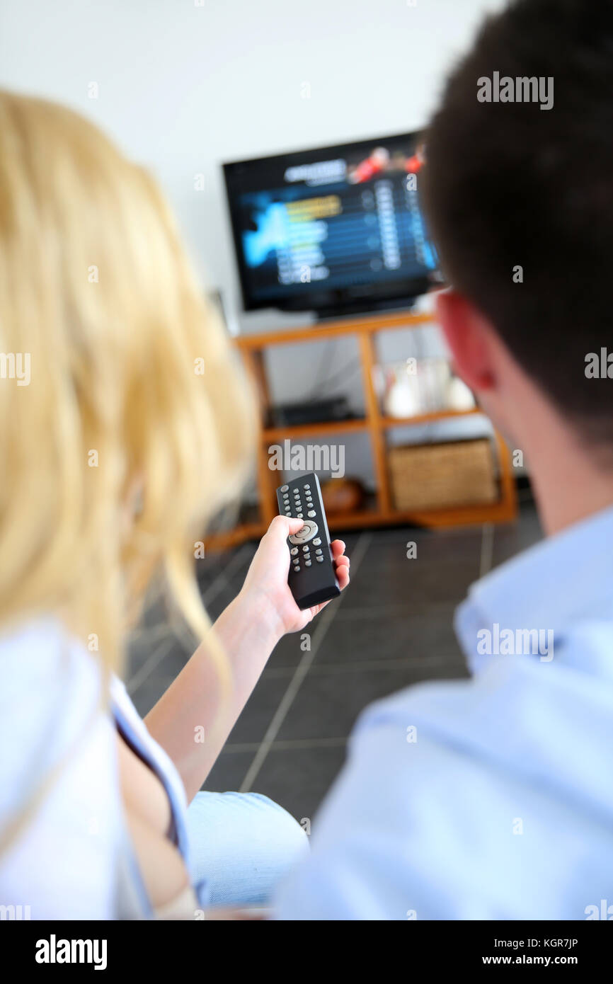Back view of couple choosing tv program Stock Photo - Alamy