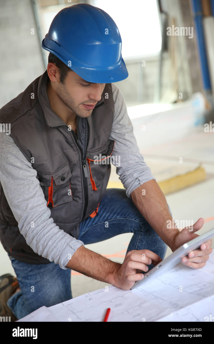 Builder helmet blueprint working hi-res stock photography and images ...