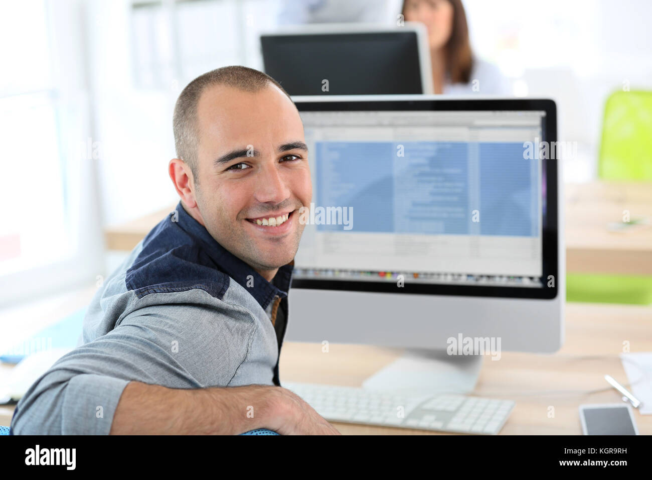 Portrait of student in front of desktop computer Stock Photo - Alamy