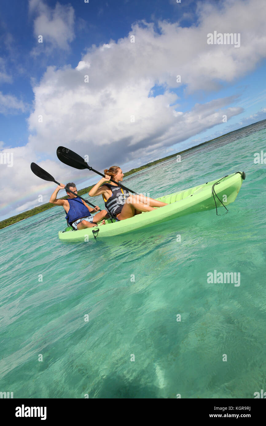 Couple canoeing in transparent caribbean sea Stock Photo - Alamy
