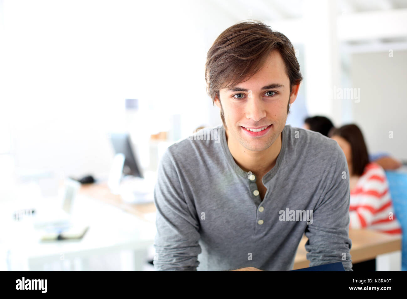 Portrait of smiling student in school class Stock Photo - Alamy