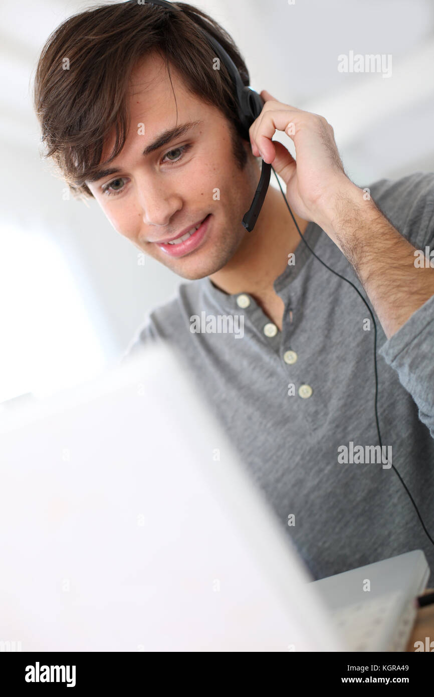 Student with headset on doing English language test Stock Photo - Alamy