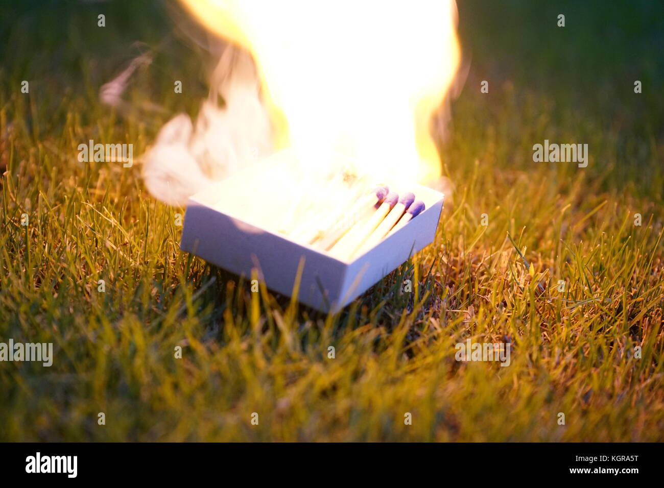 Setting fire to matchsticks Stock Photo - Alamy