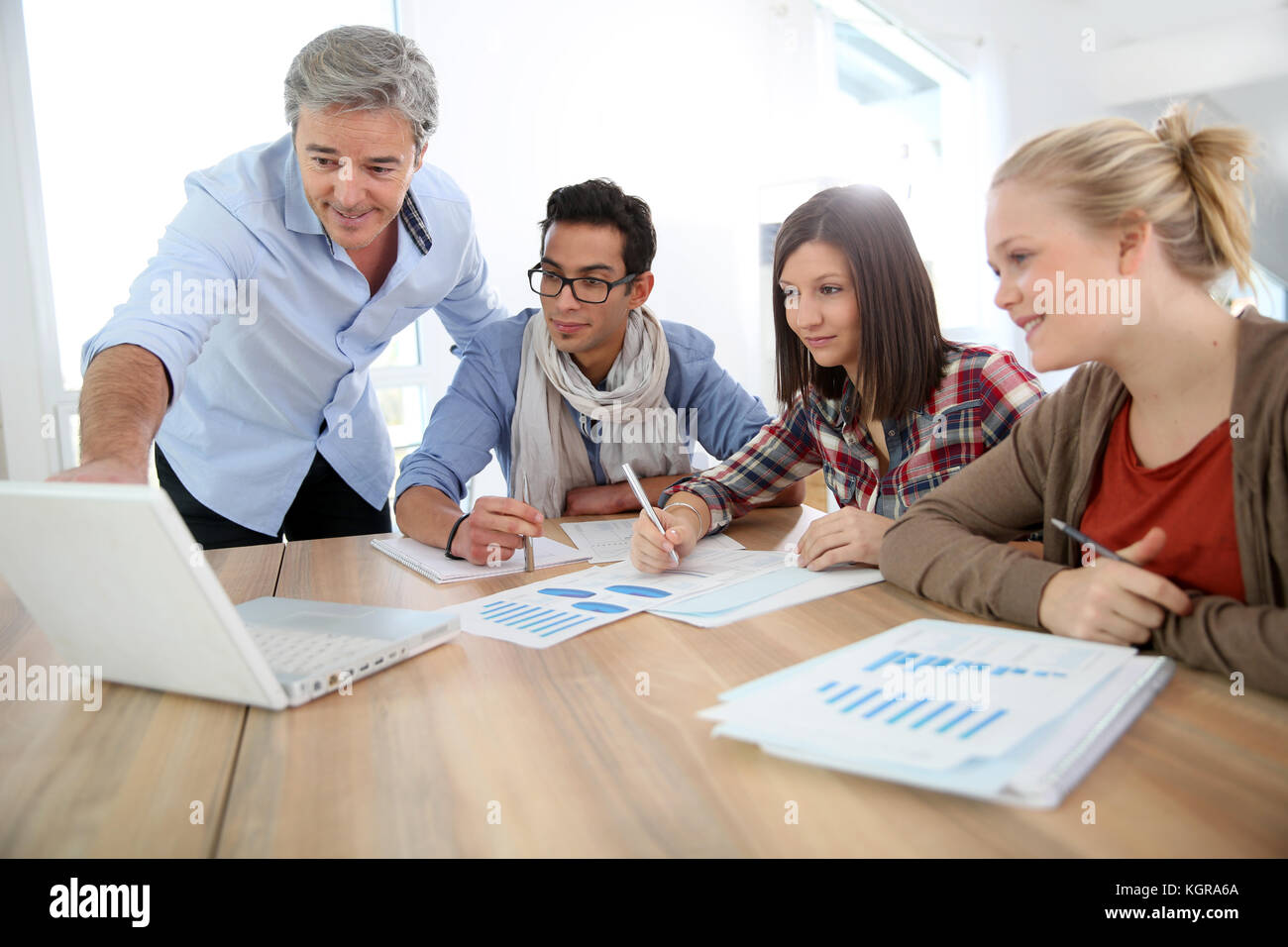 Business school students in marketing class with teacher Stock Photo ...