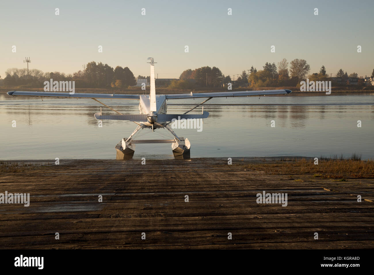 Floating plane concept freedom colorful trees ocean Stock Photo - Alamy