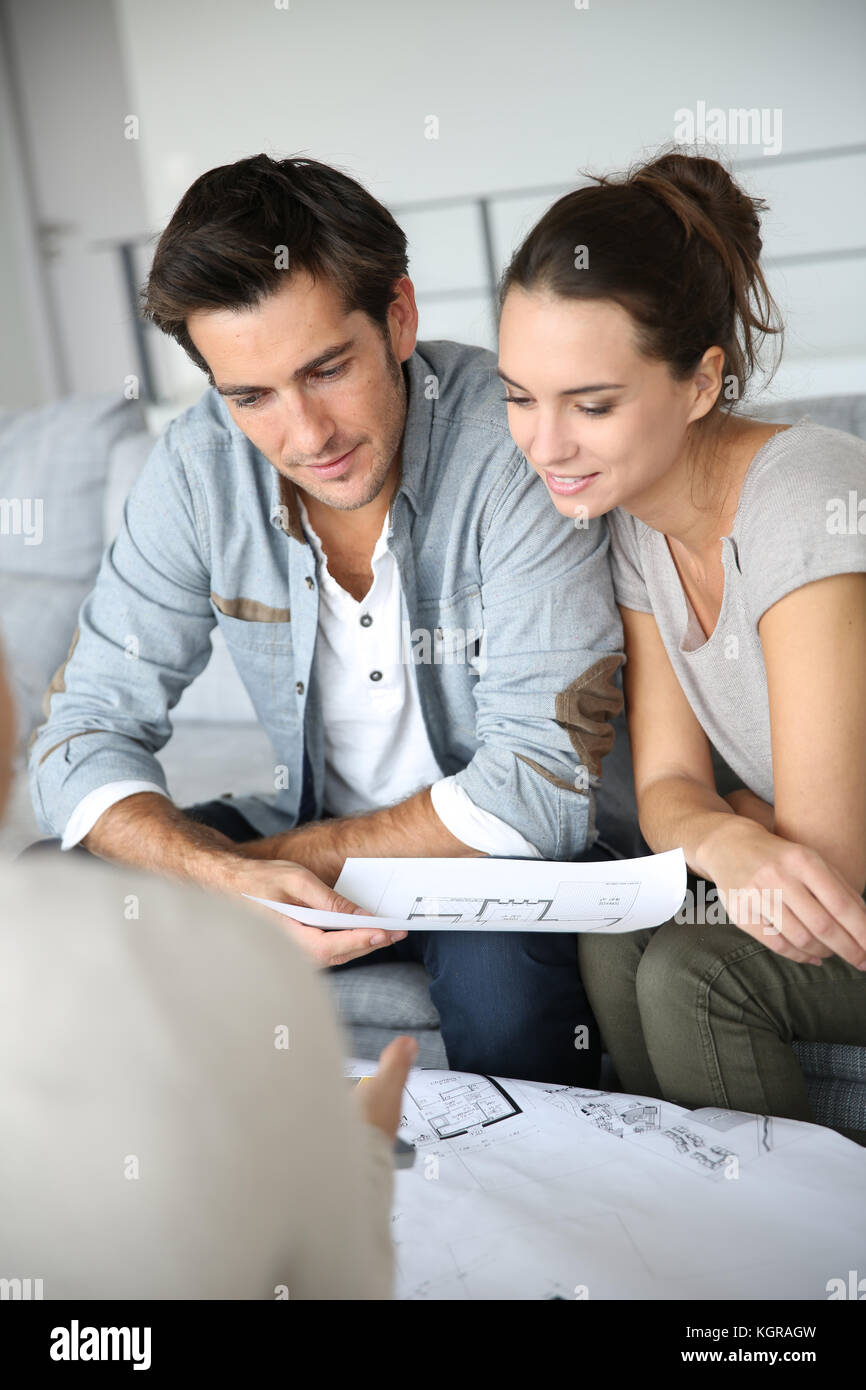 Architect client discussing plan blueprint hi-res stock photography and ...