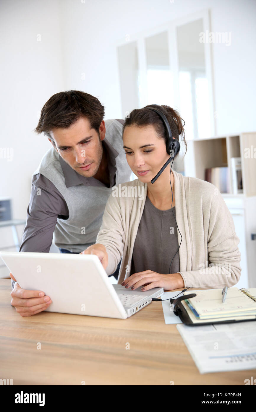 Business people working in customer service department Stock Photo - Alamy