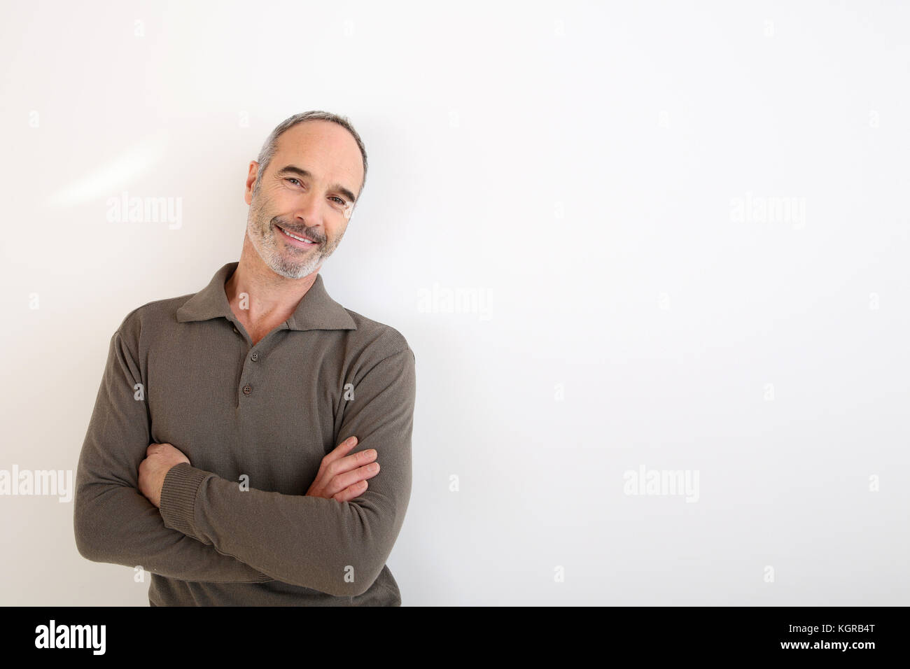 Portrait of 50-year-old man standing on white background Stock Photo ...