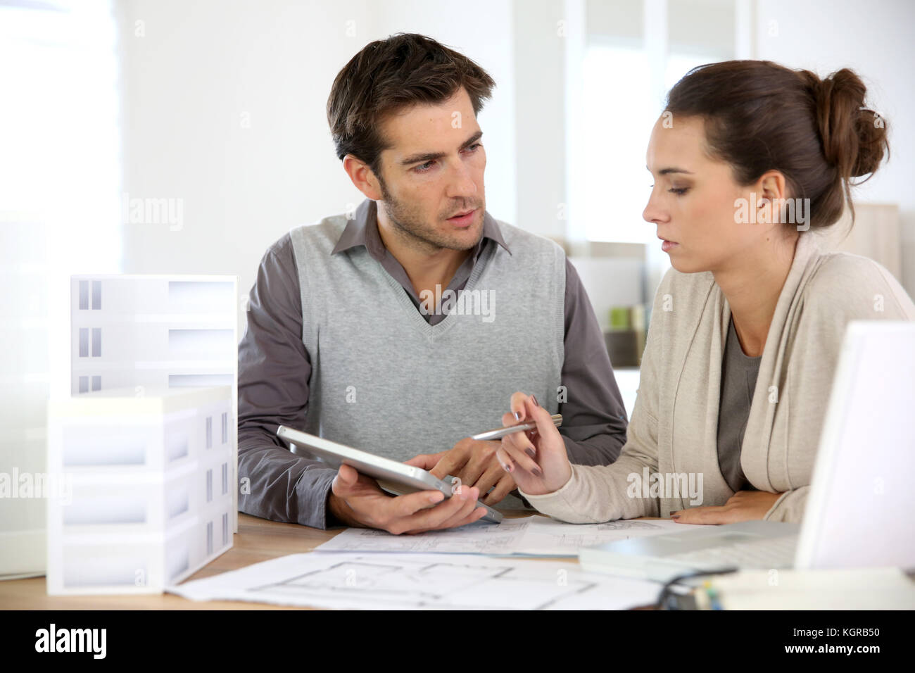 Team of architects working on project Stock Photo - Alamy