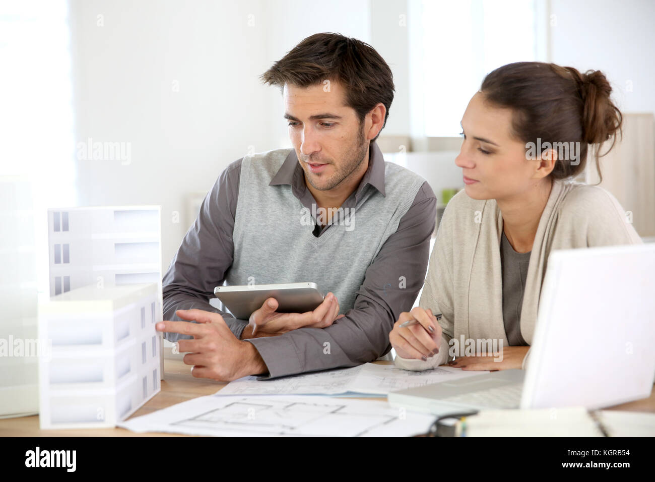 Team of architects working on project Stock Photo - Alamy