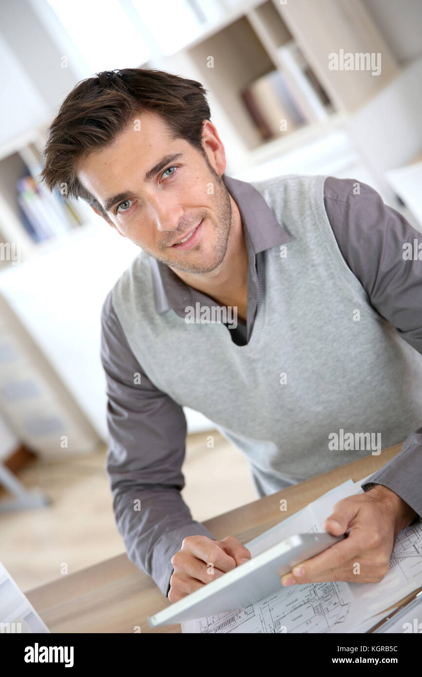 Portrait of architect using tablet in office Stock Photo - Alamy
